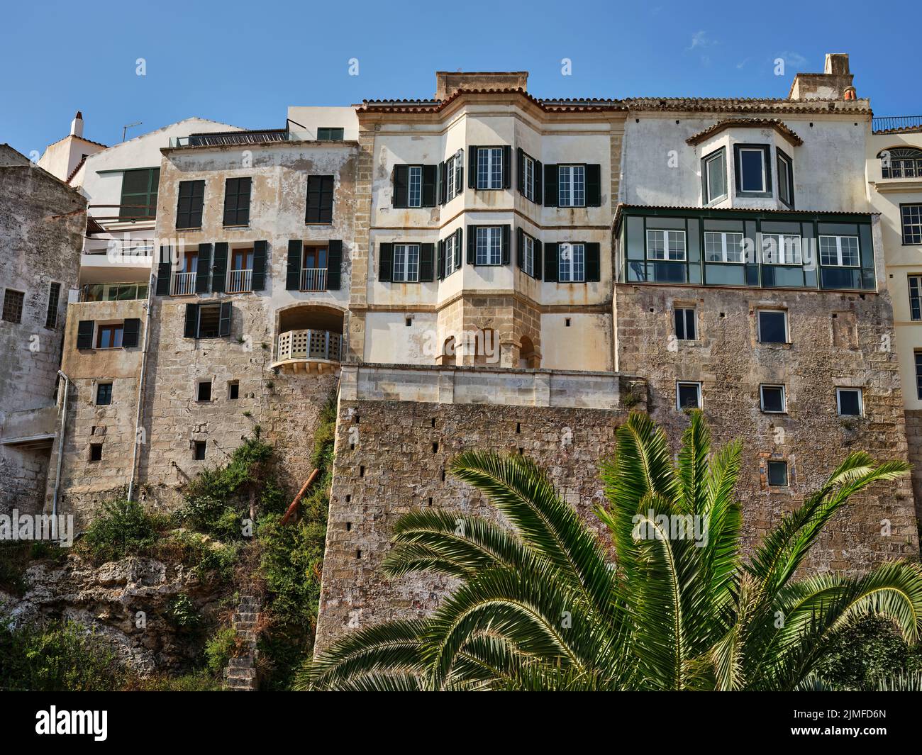 Architecture of houses on the coast of the port of Mahon (Mao) in ...