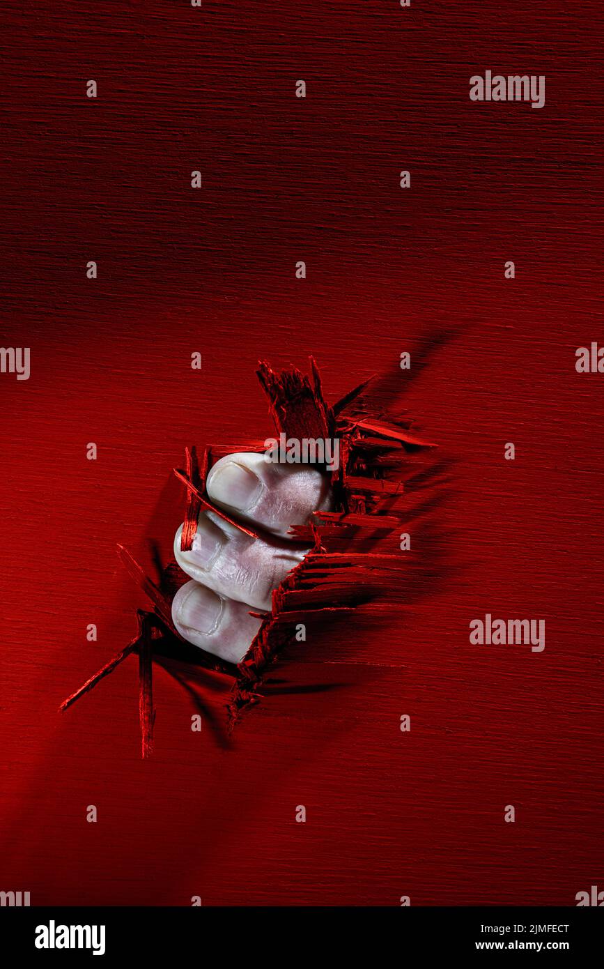 Fingers through a split in wood Stock Photo - Alamy