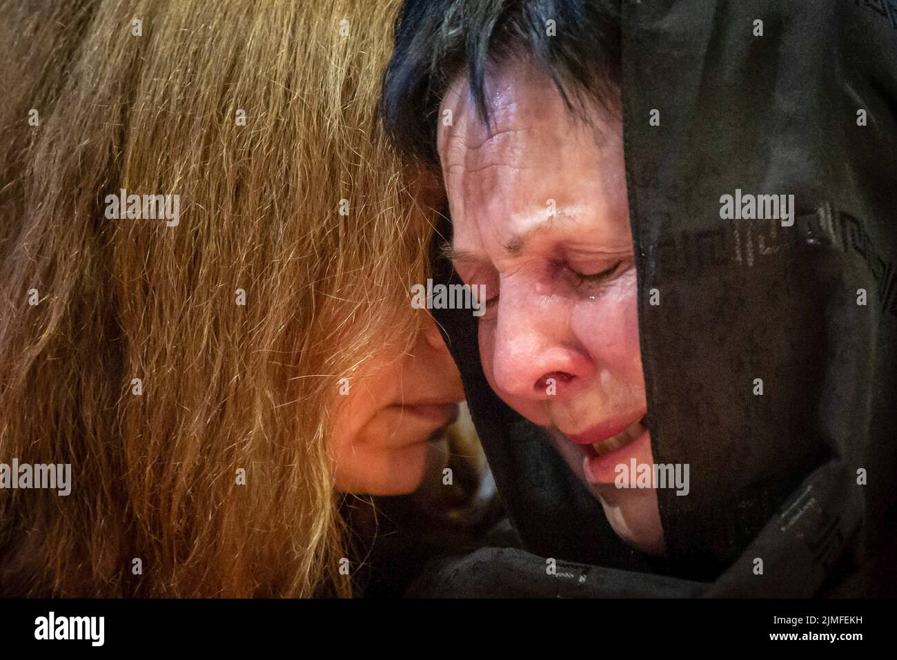 Kyiv, Ukraine. 05th Aug, 2022. Relatives react emotionally during a ...