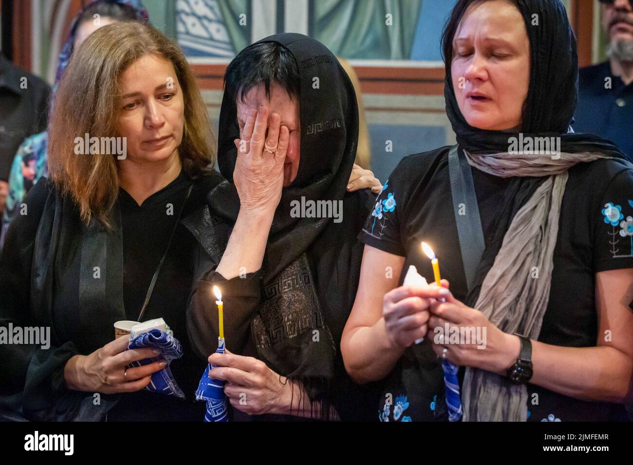 Kyiv, Ukraine. 05th Aug, 2022. Relatives react emotionally during a ...