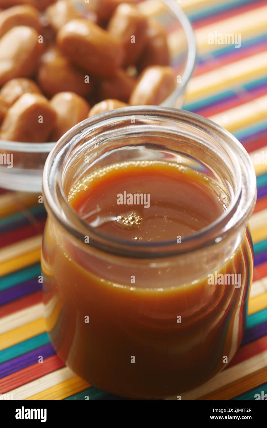 caramel chocolate bar and liquid on table top view Stock Photo - Alamy