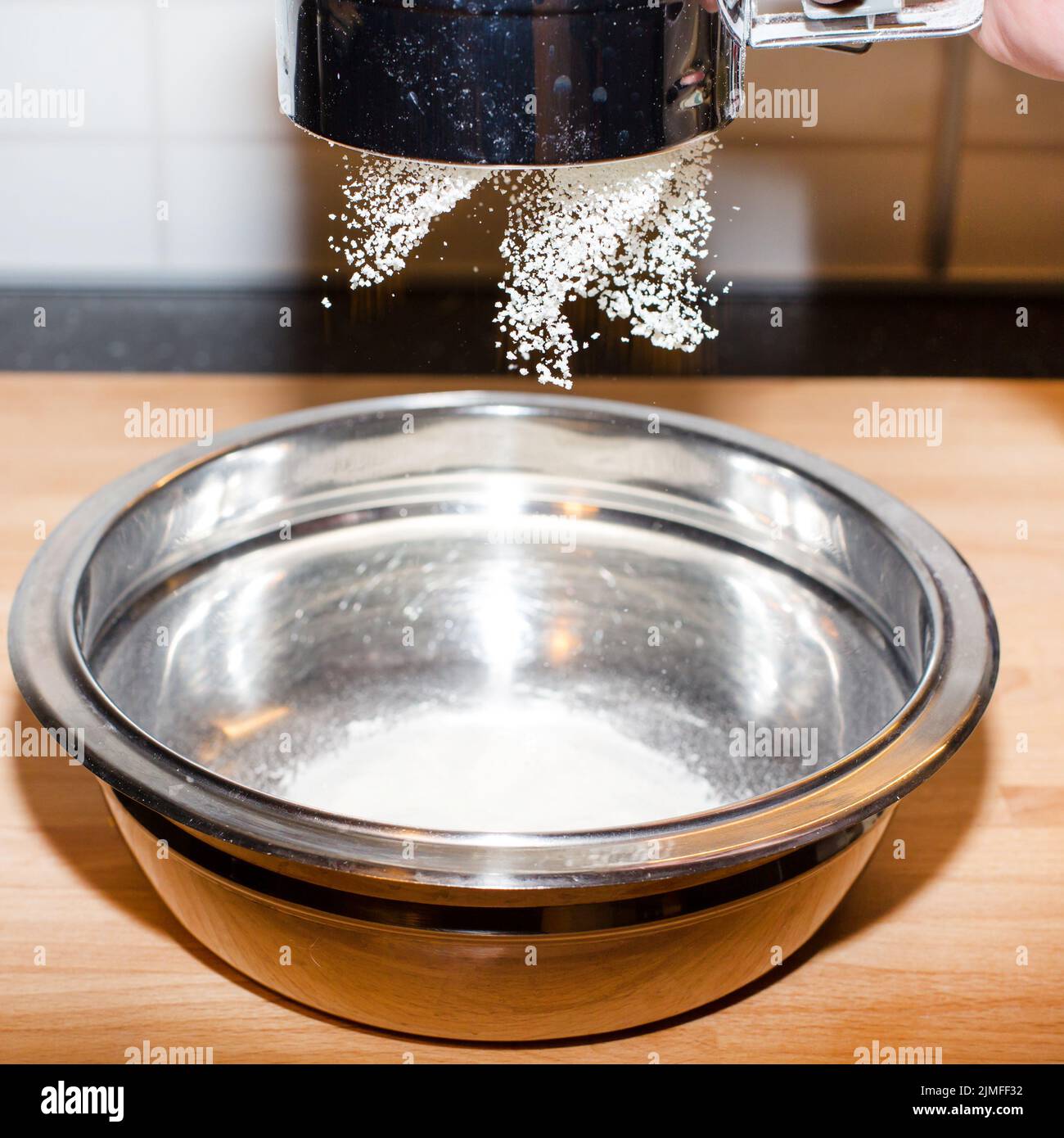 Woman sifting flour through hi-res stock photography and images - Alamy