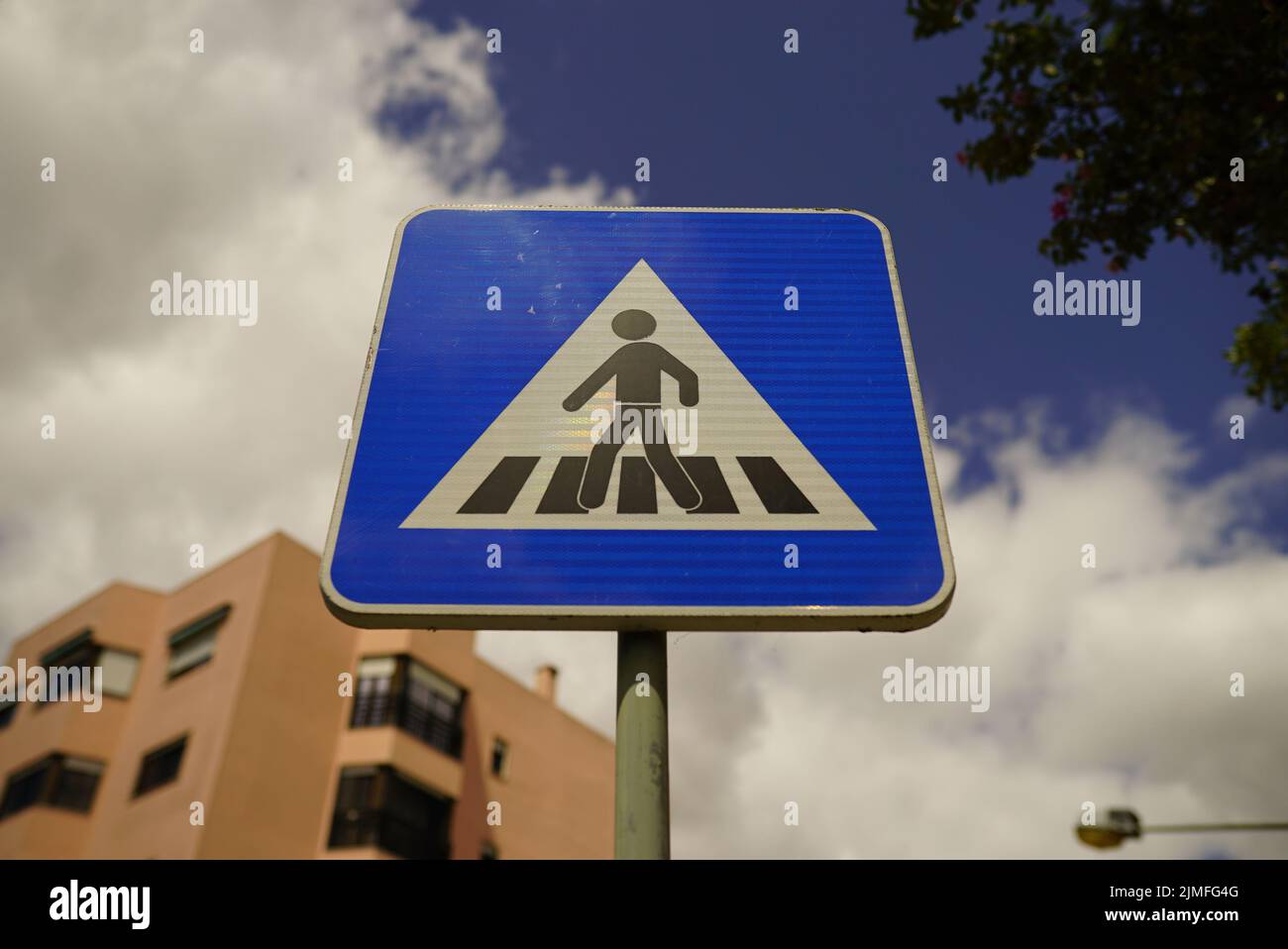 A low angle shot of a road crosswalk sign Stock Photo - Alamy