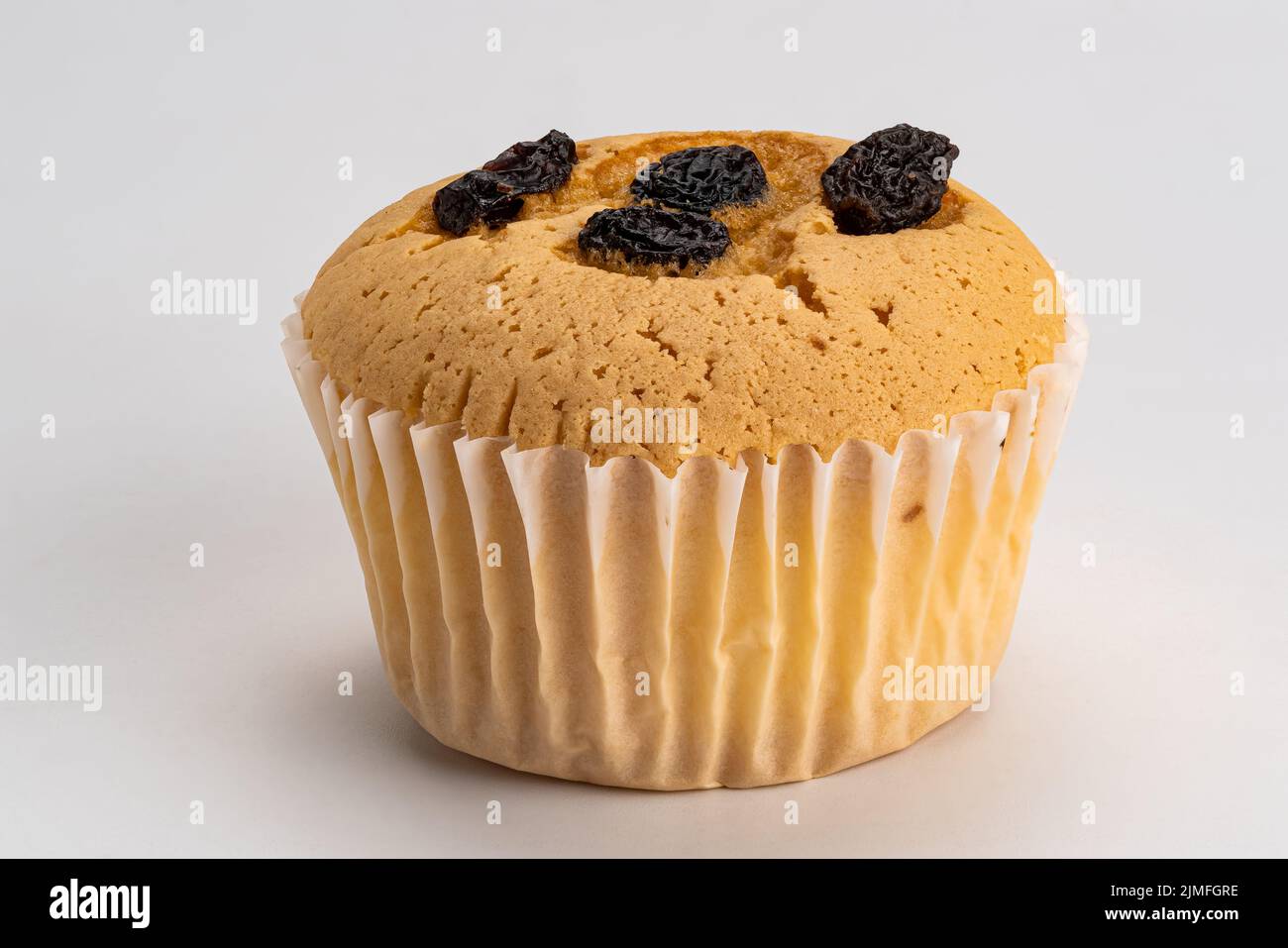 Side view of delicious homemade sponge cupcake isolated on white ...