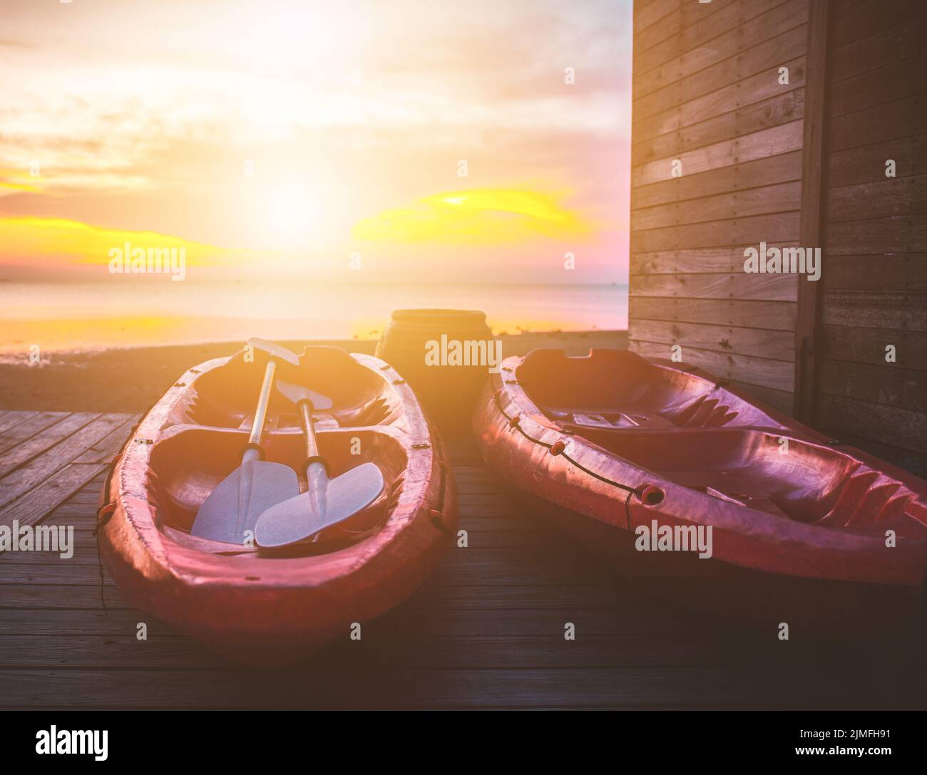 The beautiful sunset with couple red Kayak boat with sun lay Stock ...
