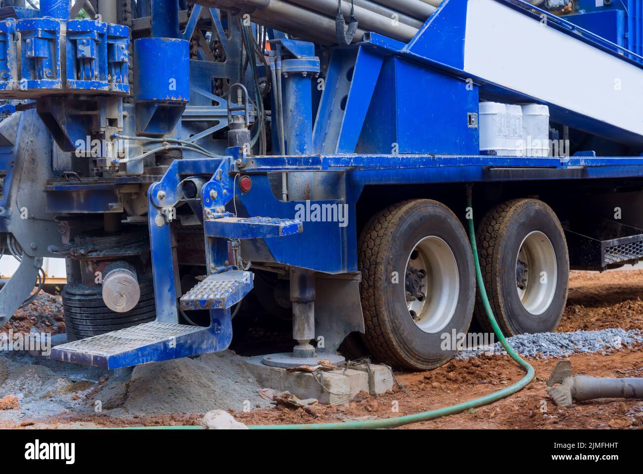 Portable hydraulic water well drilling rig with water extraction on a ...