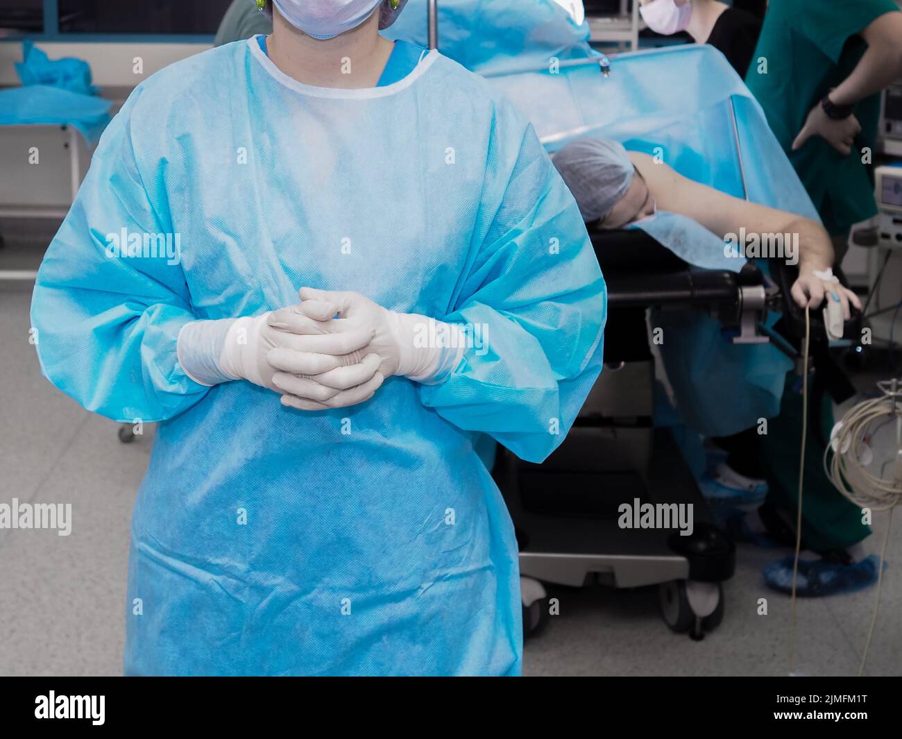 Surgeon in uniform and latex gloves in the operating room Stock Photo ...