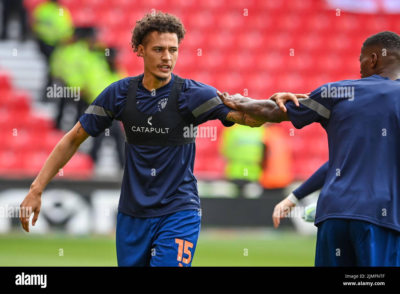 Rhys Williams #15 of Blackpool stretches during the pre-game warmup in ...