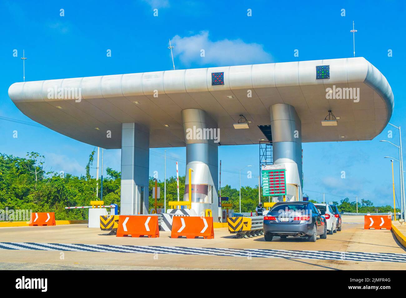 Driving on highway freeway motorway thru toll booth house Mexico Stock ...