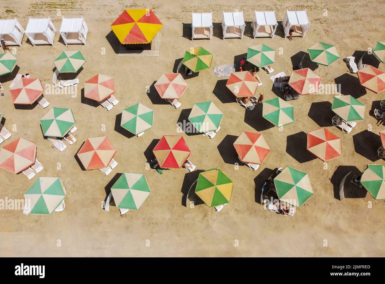 People sunbathing under umbrellas on hi-res stock photography and ...