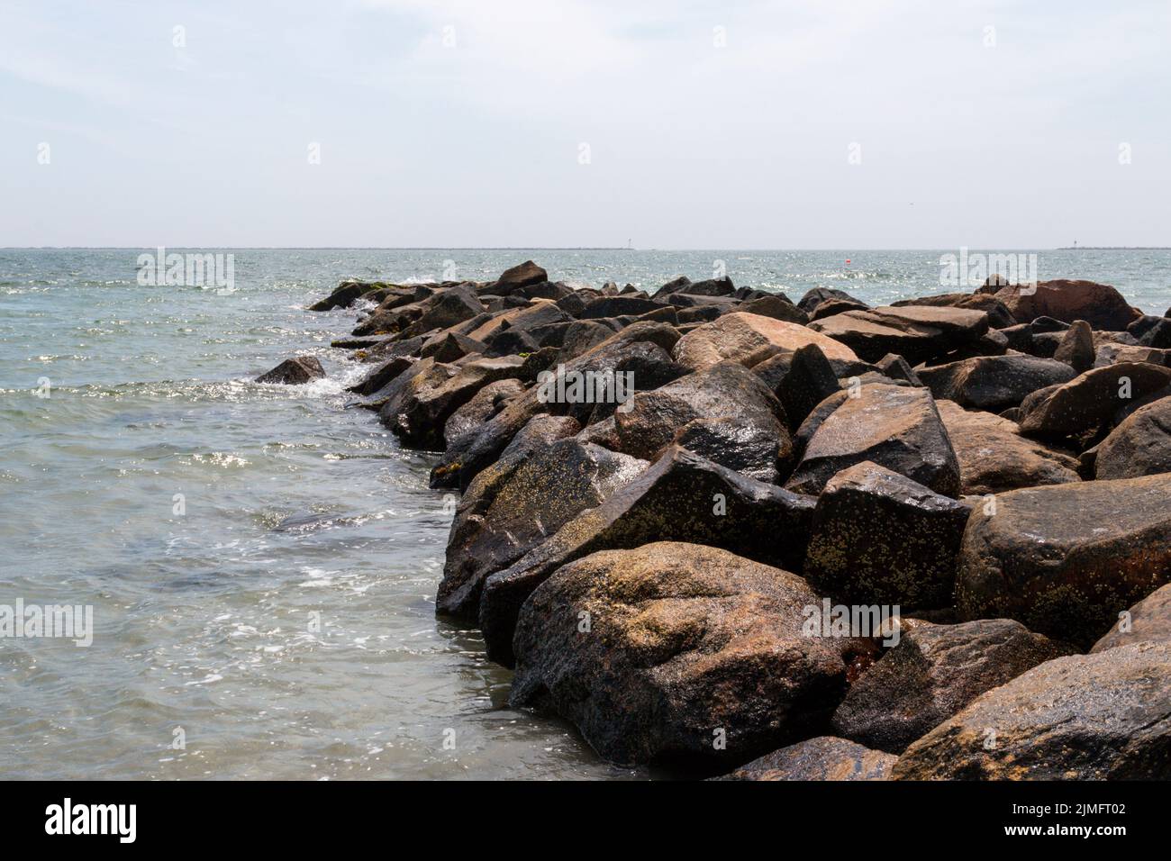 Large rock jetty extending out into Narragansett Bay close to Roger ...