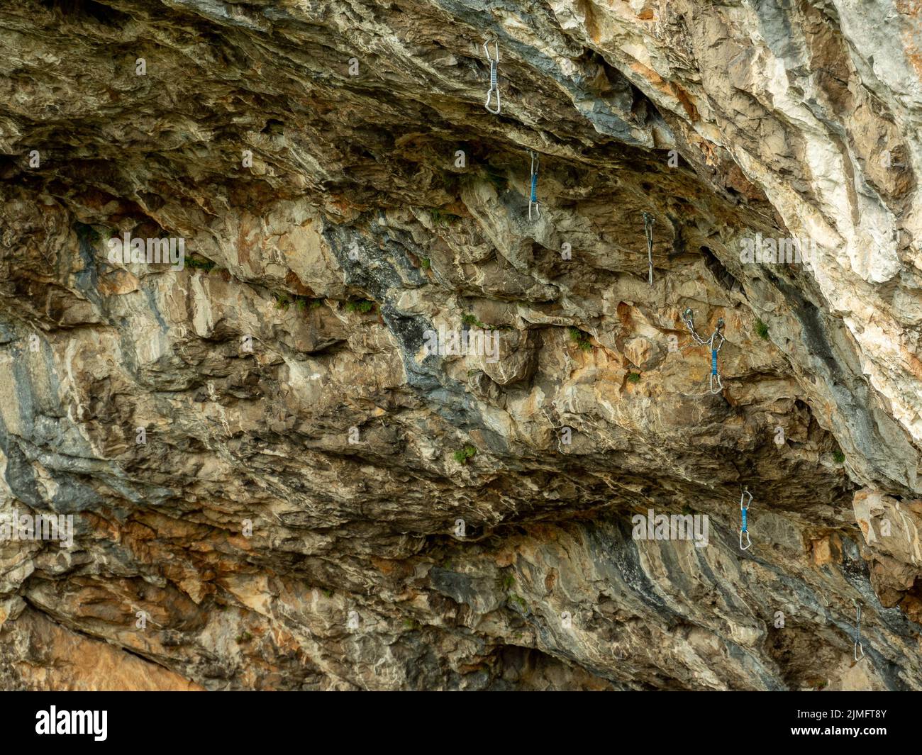 rock climbing route with cables and carabiner Stock Photo - Alamy