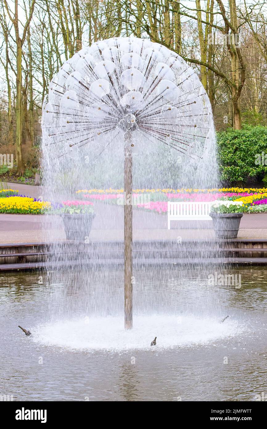 Lake and fountain in the spring flower garden Stock Photo - Alamy