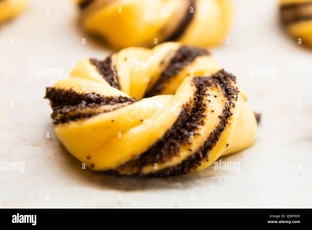 Raw buns rolls in bread bakery Stock Photo - Alamy