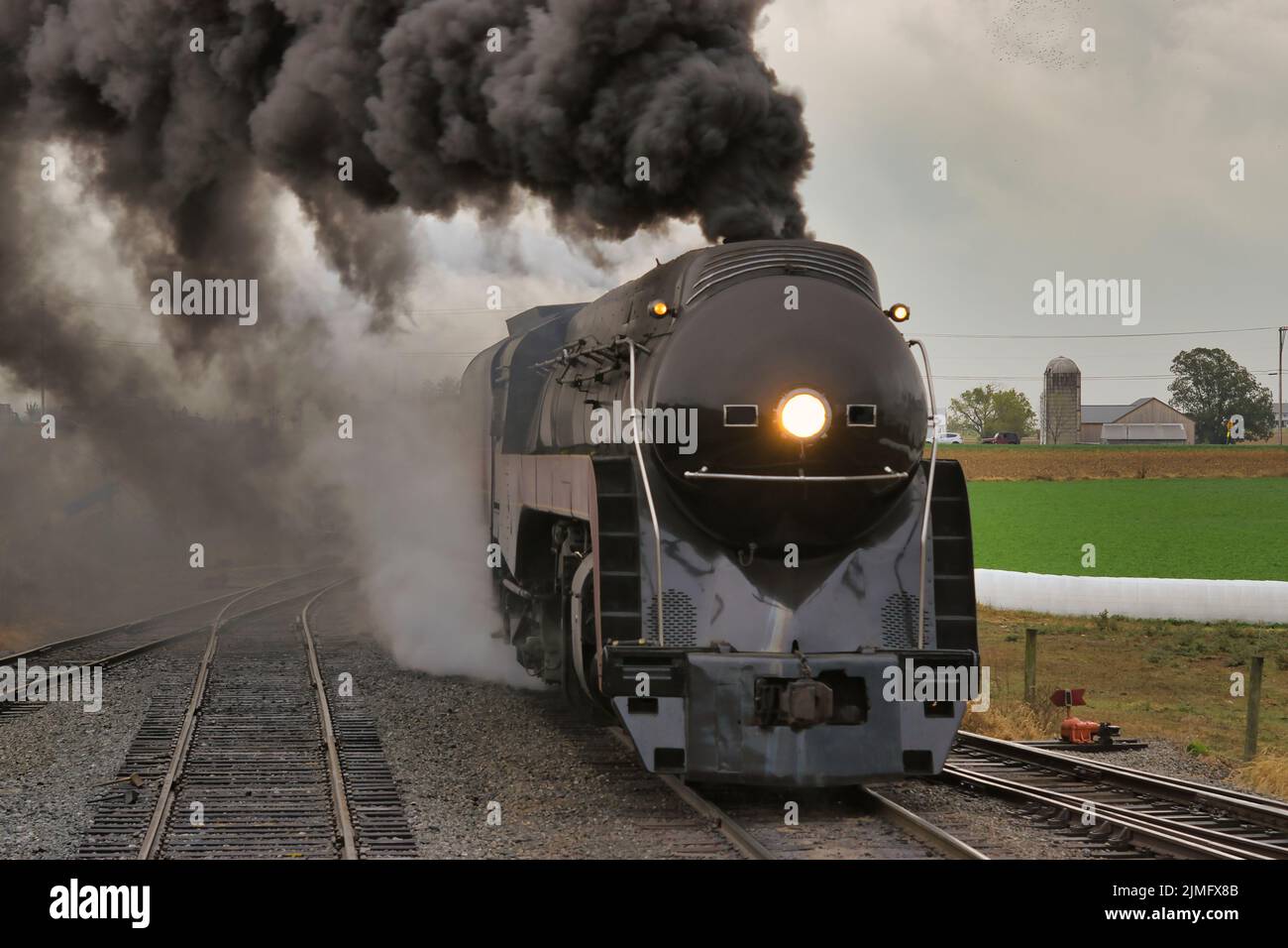 Antique Restored Steam Freight Train Approaching Blowing Smoke and ...