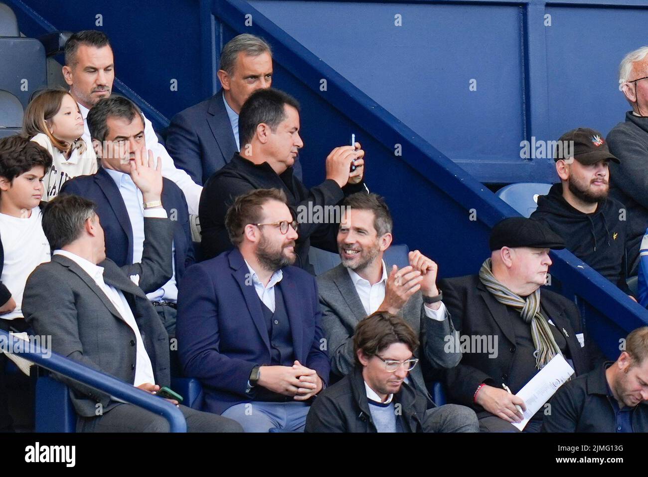 Hull City owner Acun Ilicali takes.a photo as he watches the game from ...