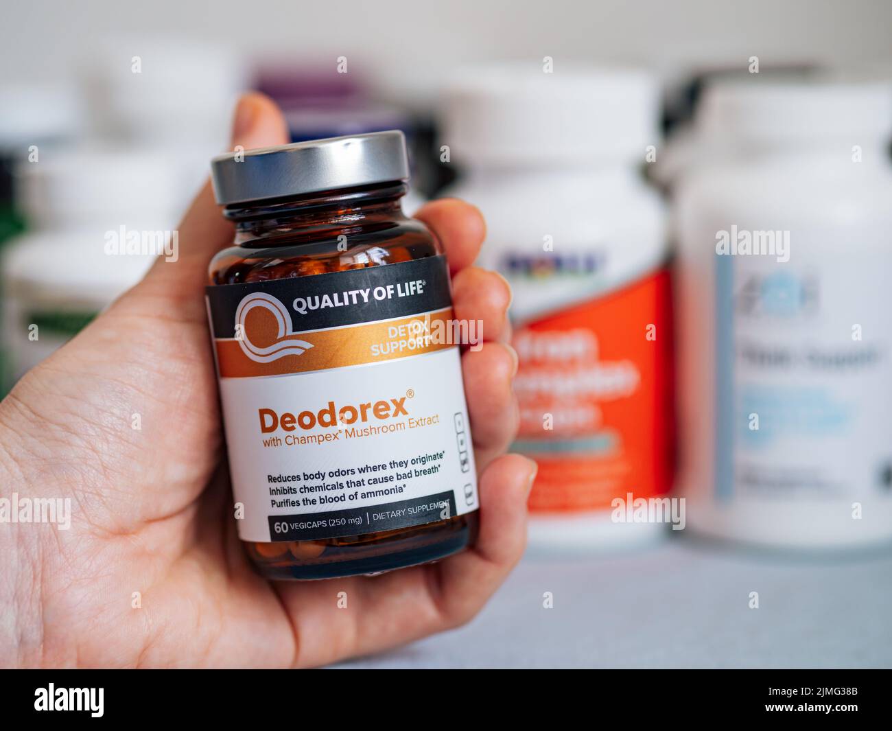 Jar with Deodorex capsules in female hand Stock Photo - Alamy