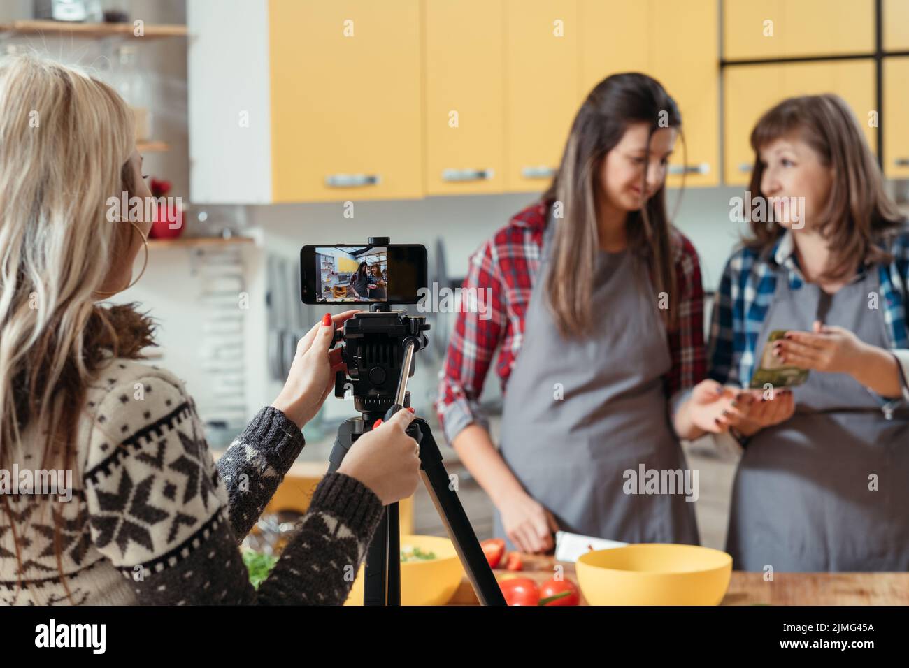 modern culinary video blog family cooking hobby Stock Photo - Alamy