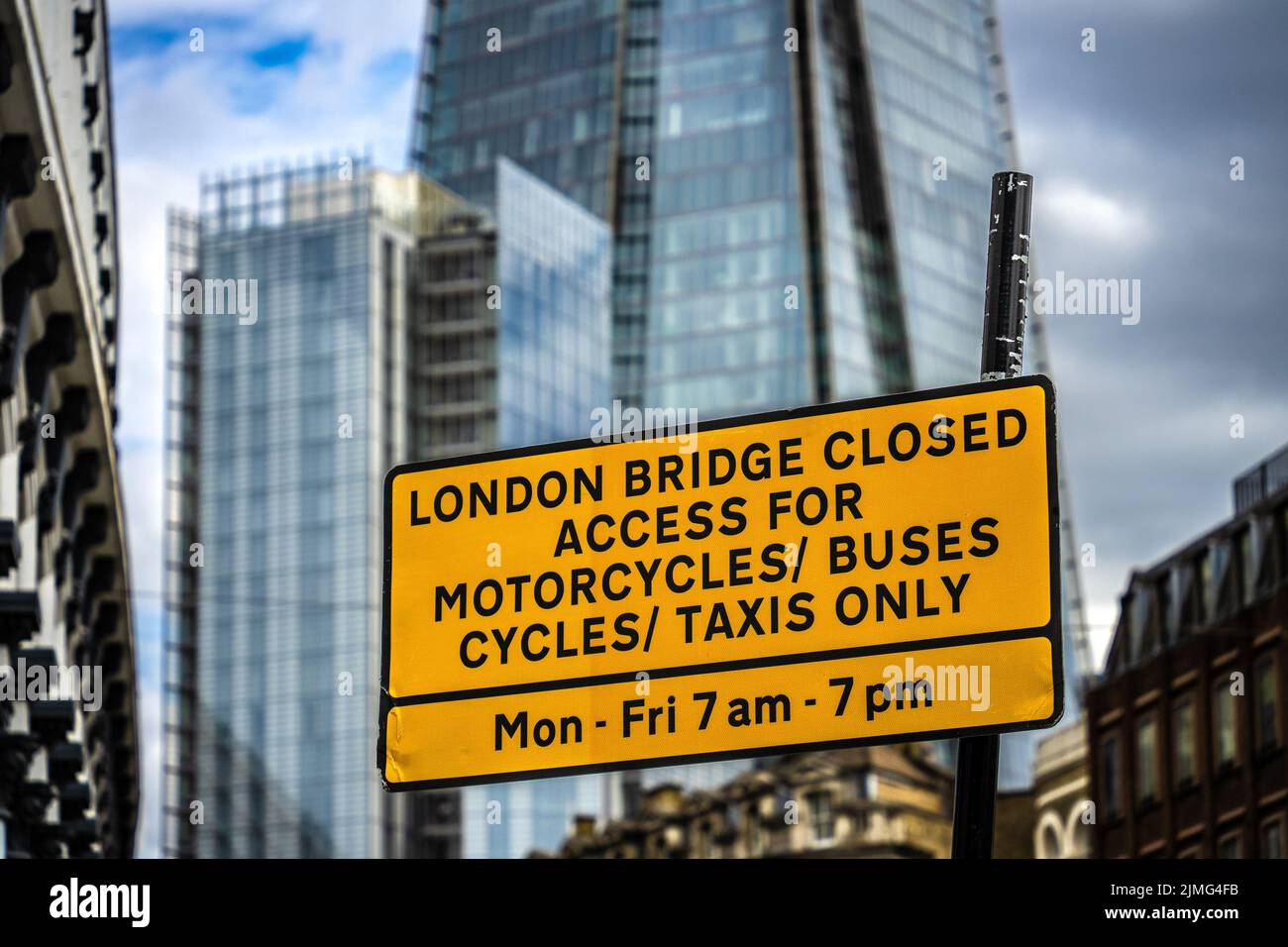 London, UK - Jun 09 2022: Bright yellow warning sign for closed bridge ...