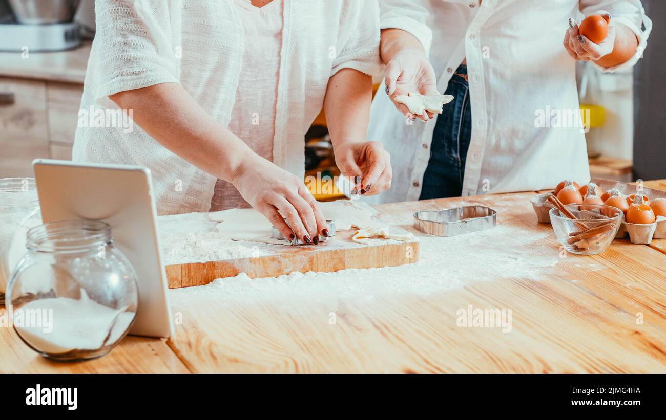 women baking home bake foods hobby leisure Stock Photo - Alamy