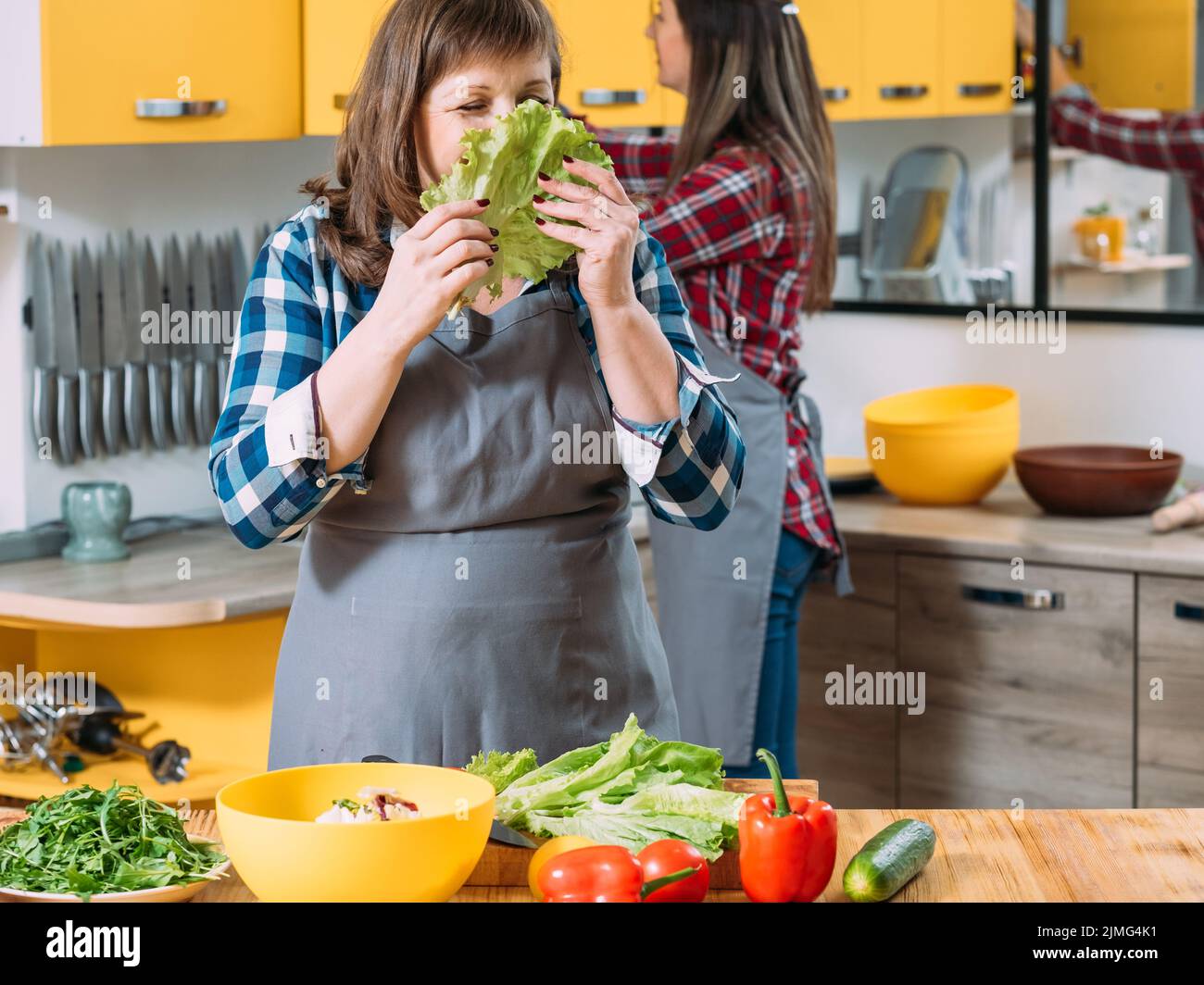 Mother daughter cooking smelling hi-res stock photography and images ...