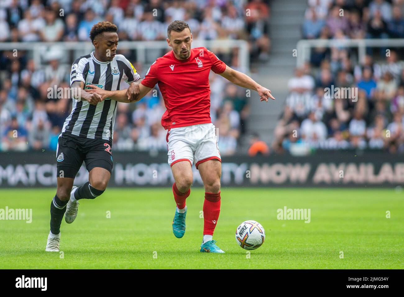 Harry Toffolo #15 of Nottingham Forest holds off a challenge from Chris ...