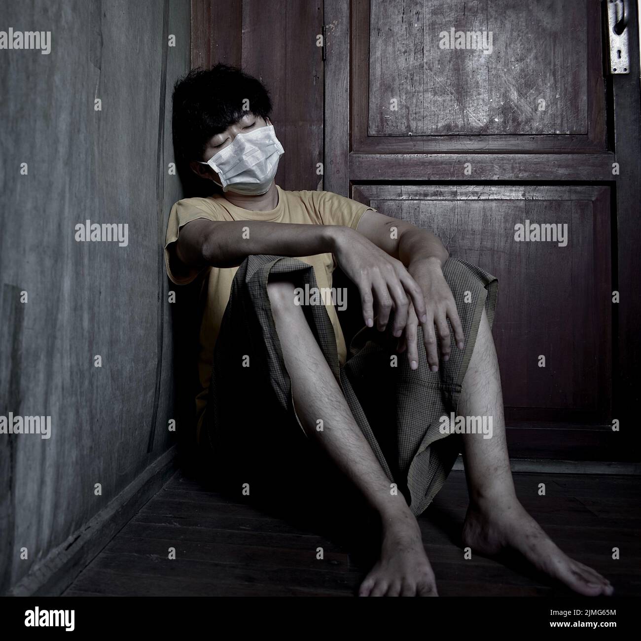 Asian young man with face mask. Concept of burnout, tiredness, weakness ...