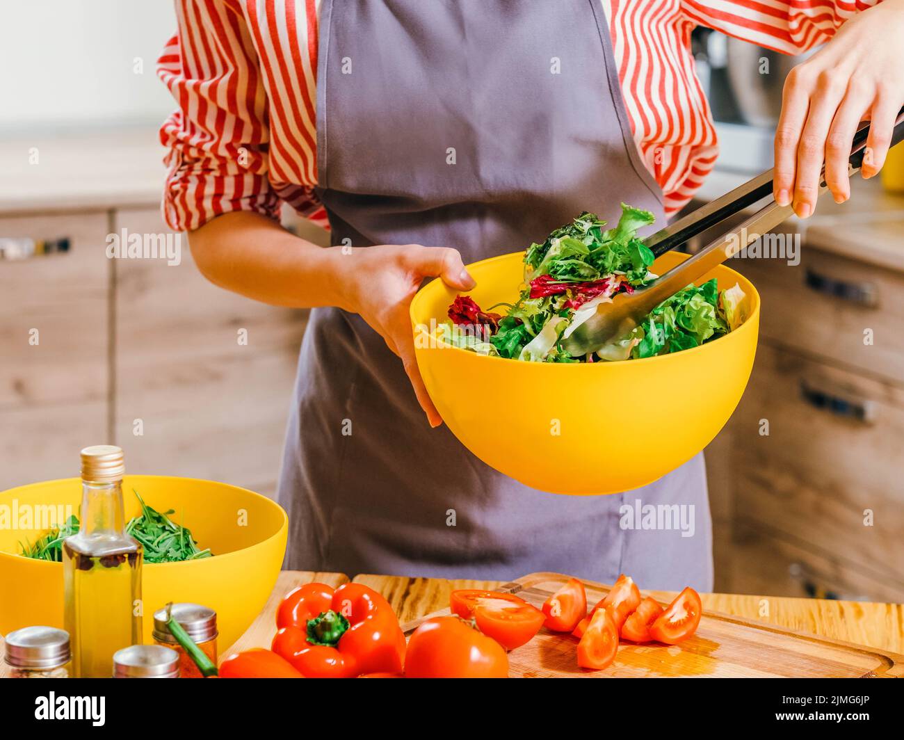healthy nutrition woman cooking vegetable salad Stock Photo - Alamy