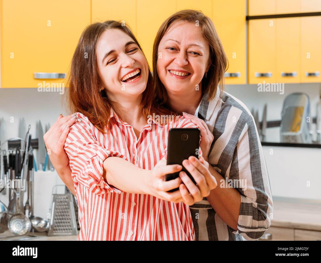 modern technology happy mother daughter selfie Stock Photo - Alamy