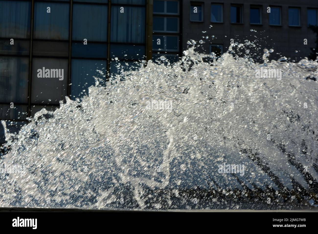 Bright splashes of clean water, jets, drops scatter from the fountain ...