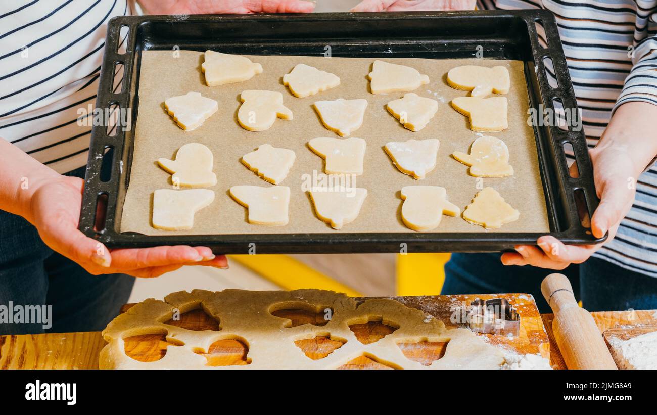 homemade cookies recipe women sheet pan biscuits Stock Photo - Alamy
