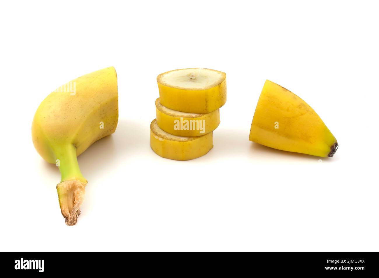 Banana cut into pieces isolated on white background close up Stock ...