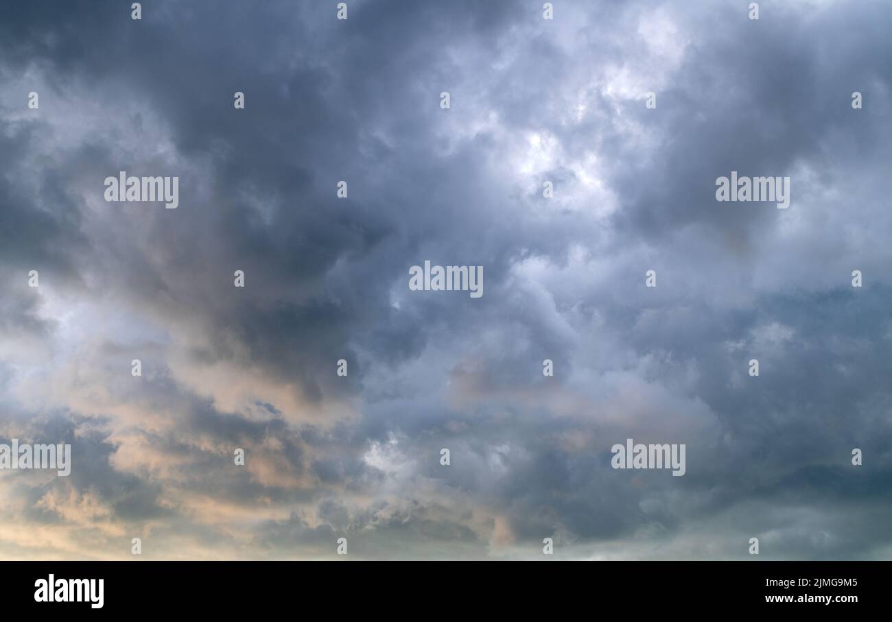 Overcast heavy sky with gray heavy clouds. Bad weather, dusk, typhoon ...