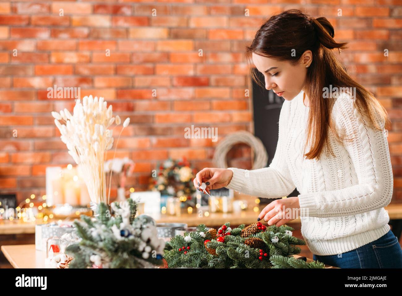 florist craft studio lady christmas decoration Stock Photo - Alamy