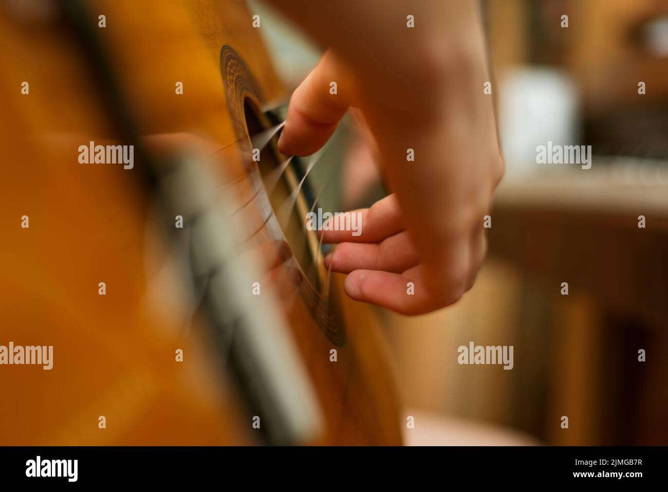 Kids hands on guitar strings. Playing guitar Stock Photo - Alamy