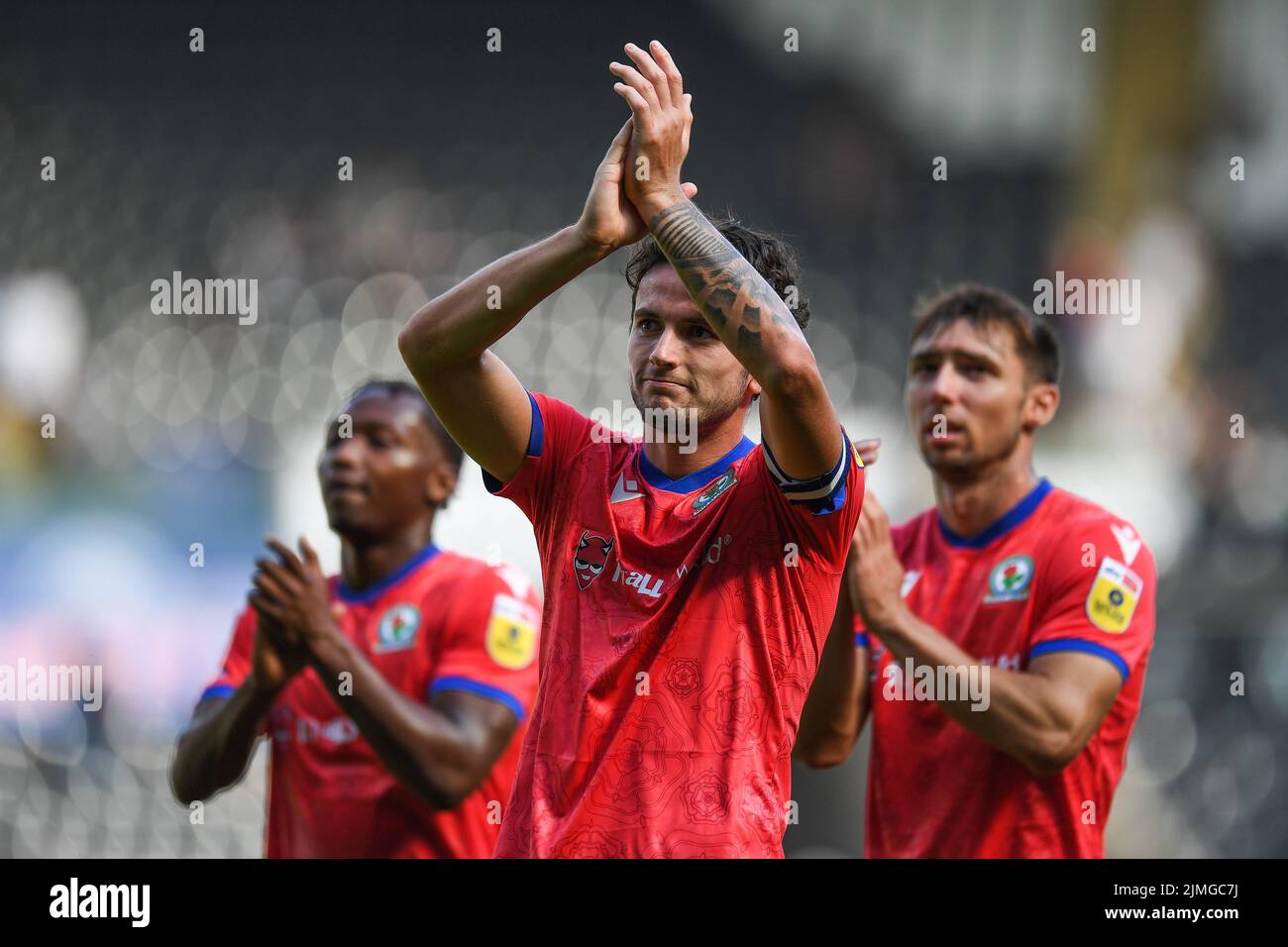Lewis Travis (27) of Blackburn Rovers Applauds the travelling ...