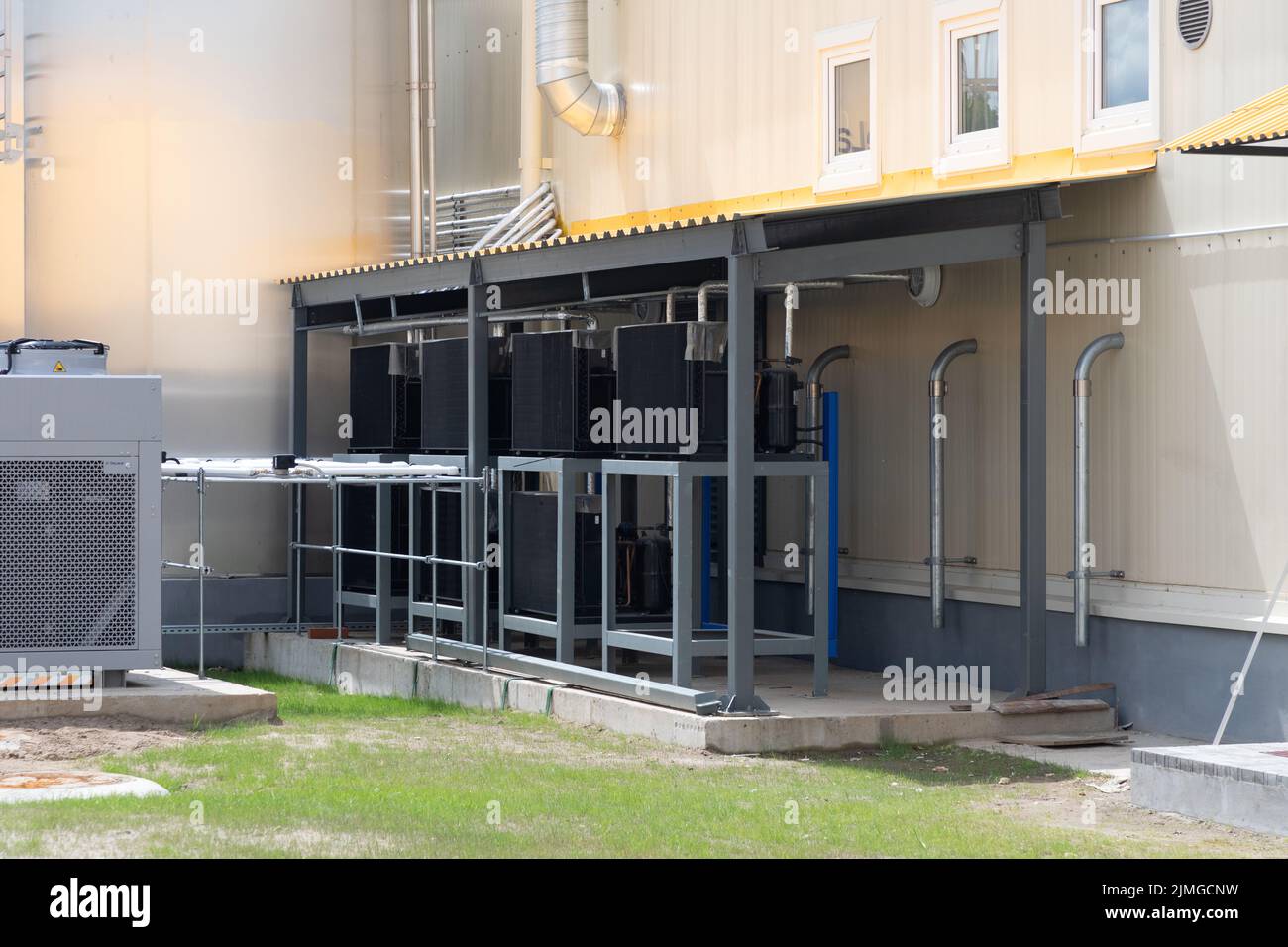 modern air conditioning system with large outdoor units for heat ...