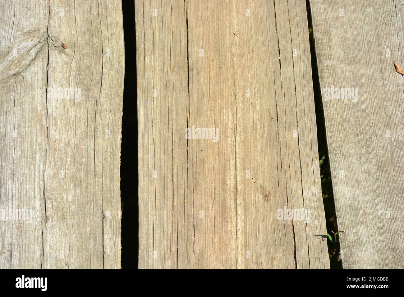 Old natural wooden boards with interesting patterns illuminated by ...