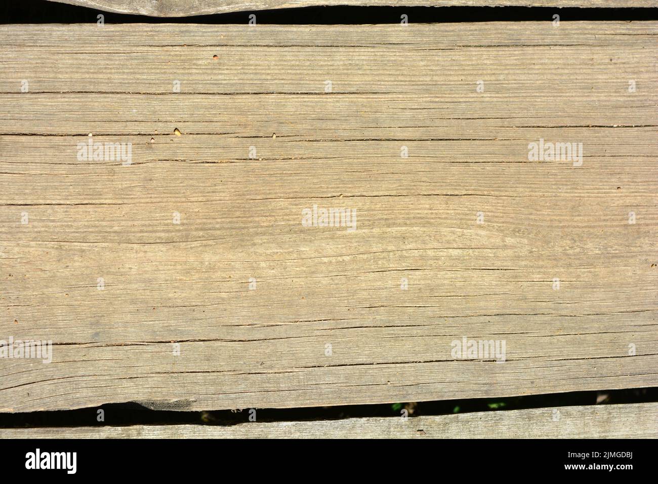 Old natural wooden boards with interesting patterns illuminated by ...