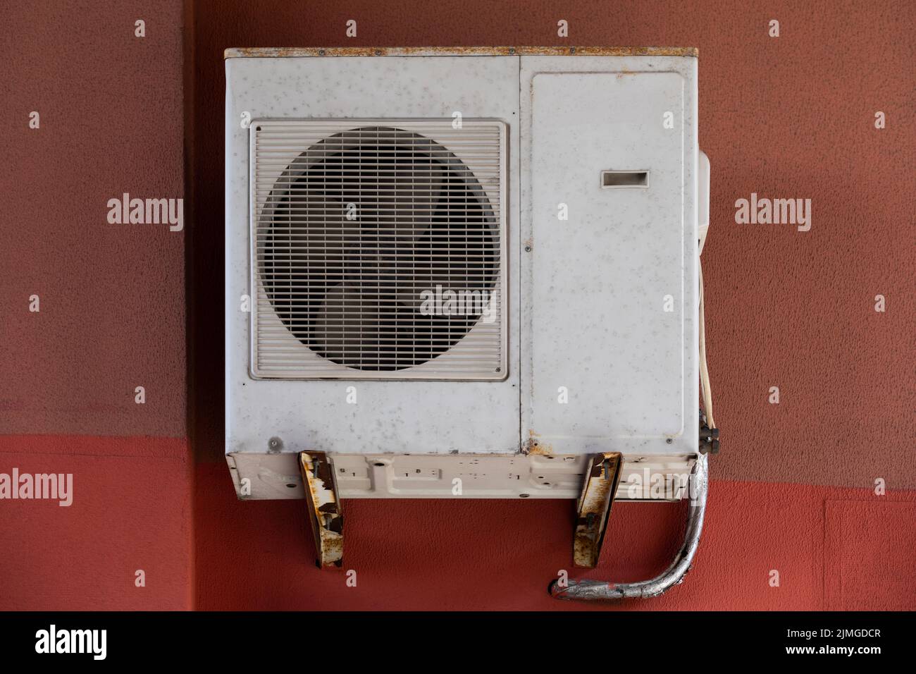 old outdoor air conditioner unit hanging outside the building Stock ...
