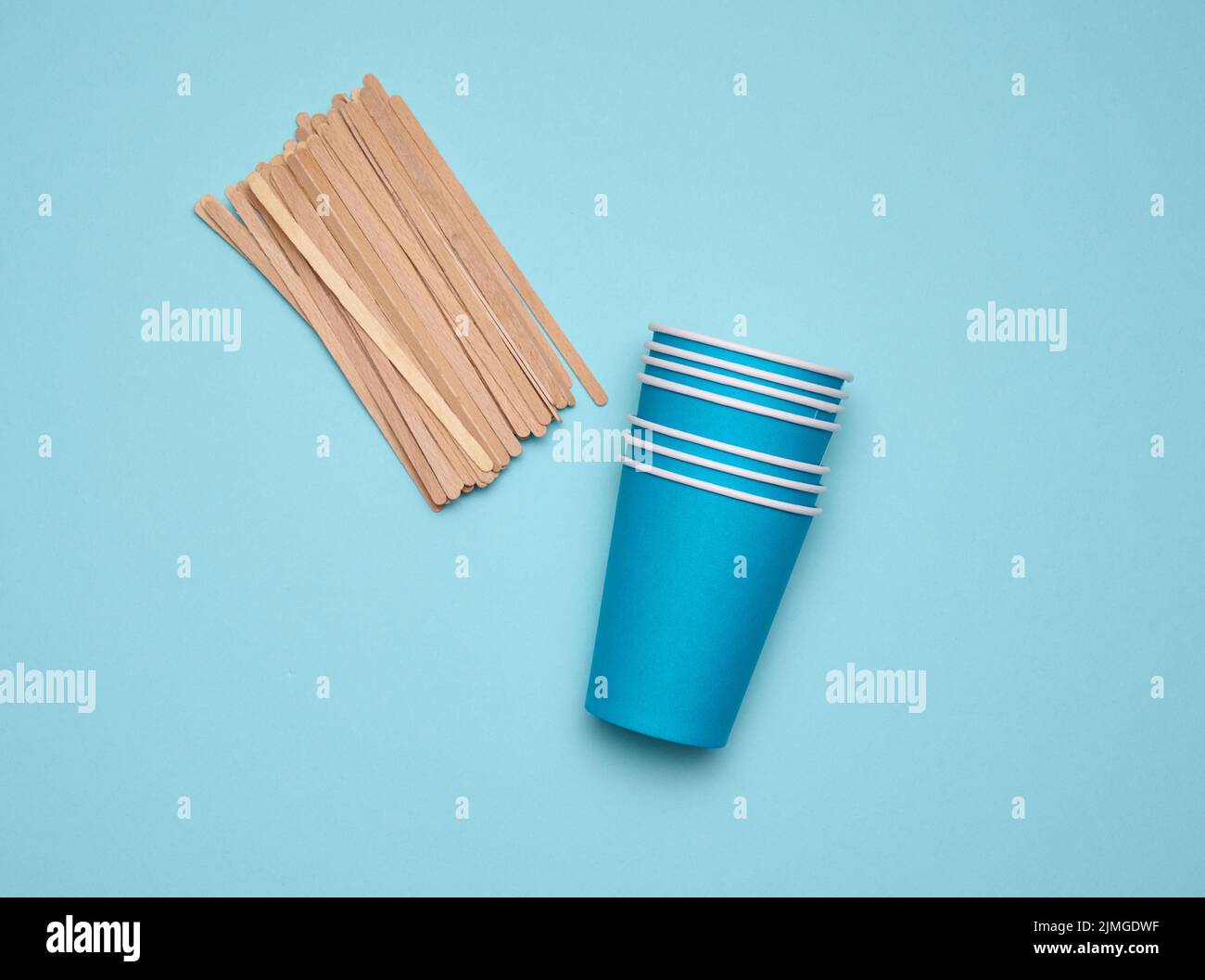Stack of blue paper cups on a blue background. Plastic rejection ...