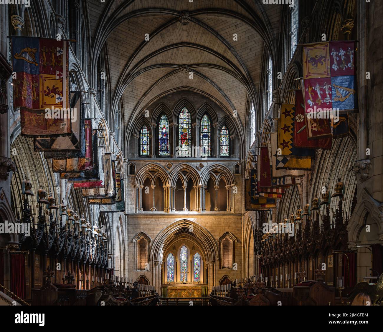 Flags and pennants on both sides of illuminated altar in St. Patricks ...