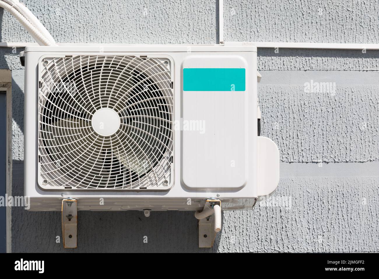 outdoor air conditioner unit on the wall of a building Stock Photo - Alamy