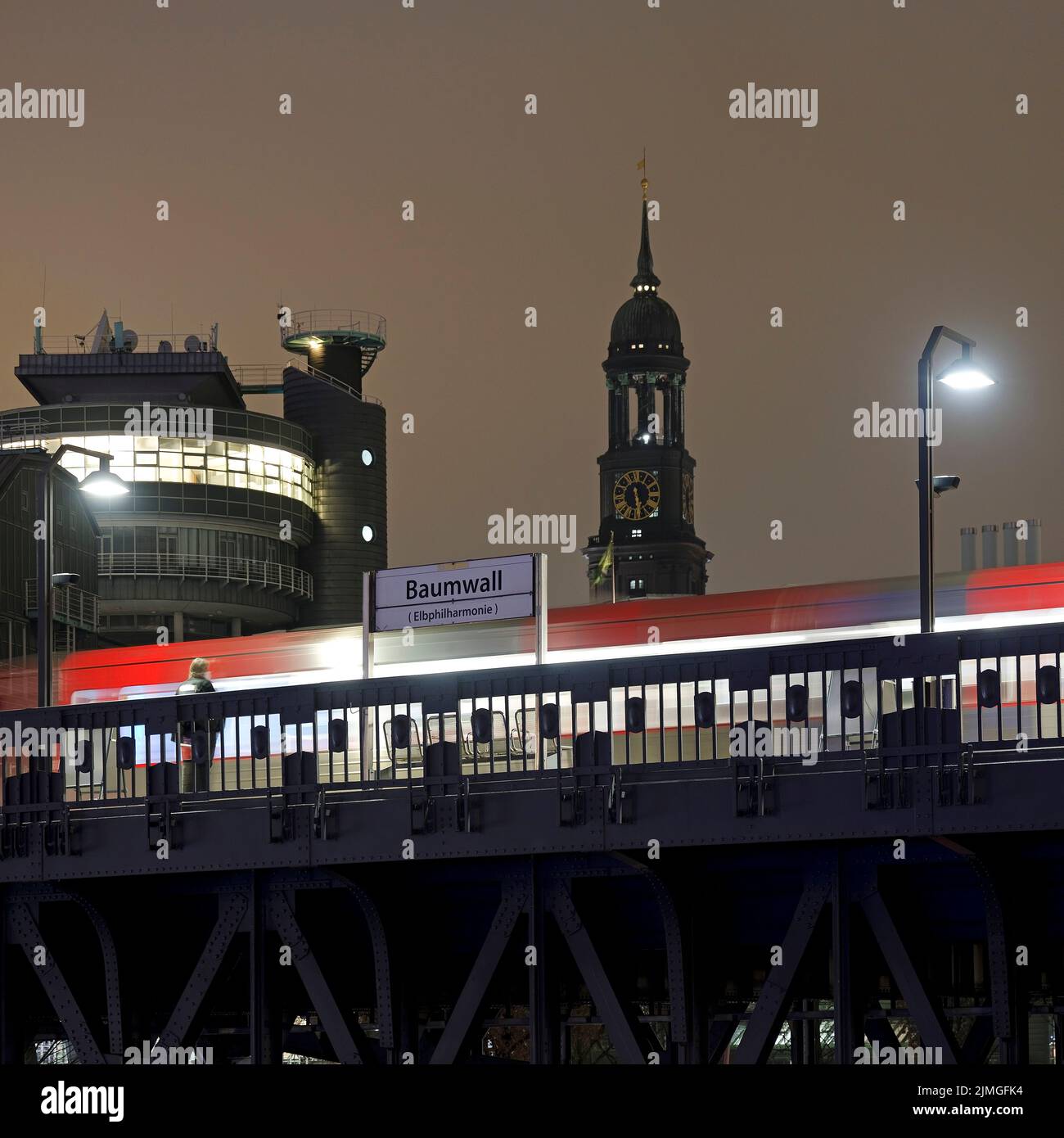Baumwall subway station with the tower of St. Michaelis church at night ...