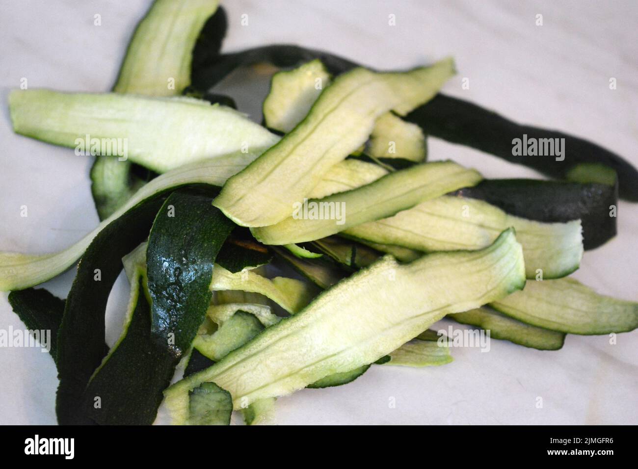 Healthy food, cooking products, vegetables. Green peelings, zucchini ...