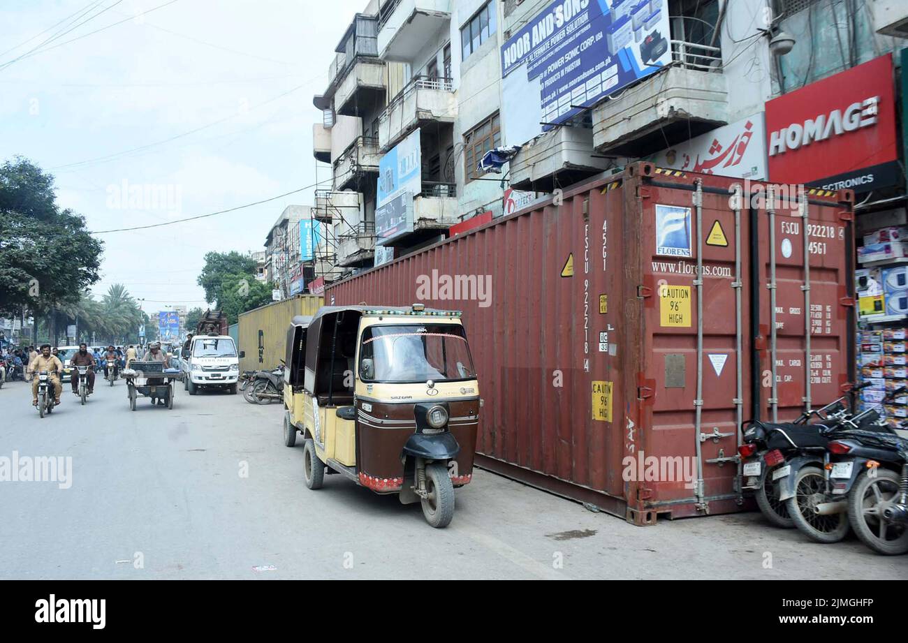 Containers are being placed by Sindh Police as the security ...