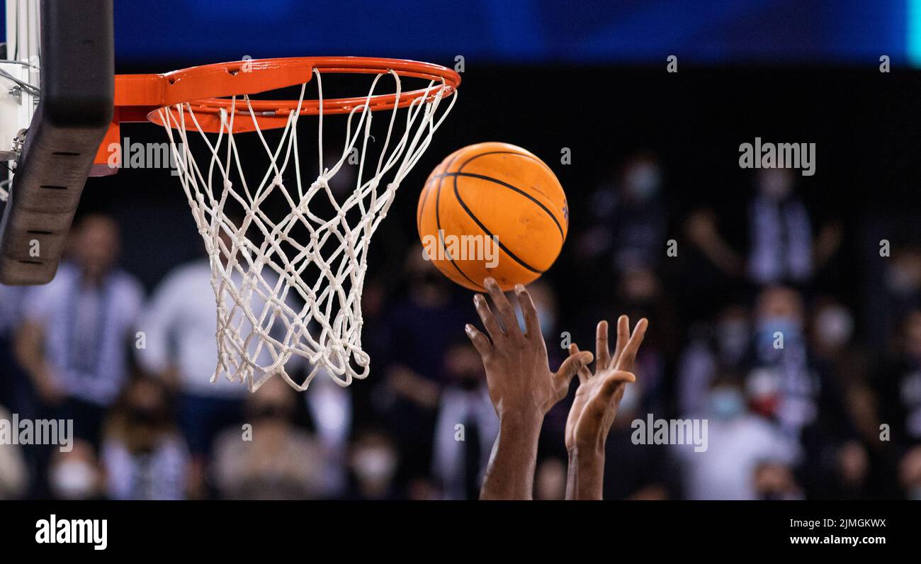 Basketball game focus on ball Stock Photo - Alamy