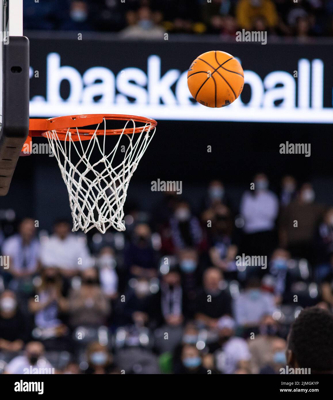 Basketball game focus on ball Stock Photo - Alamy