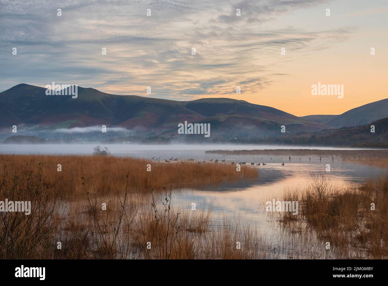 Epic Autumn sunrise landscape image looking from Manesty Park in Lake ...