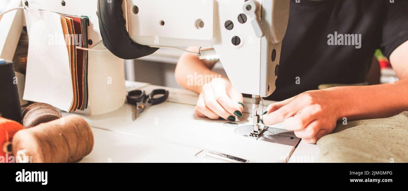 Hands seamstress sewing professional machine hi-res stock photography ...